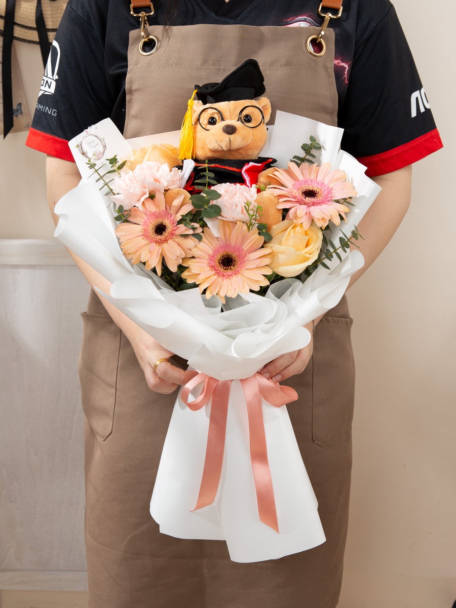 Serene Graduate | Gerbera Daisy, Peach Rose, Carnation Graduation ...